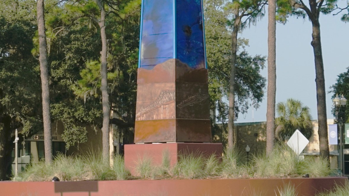 Glowing blue obelisk dedicated as public art at JU main gate | Jacksonville Today